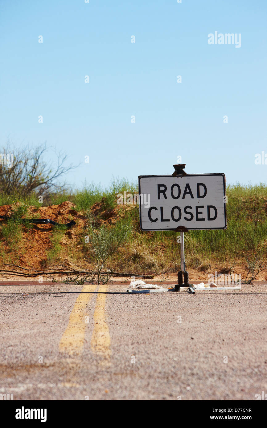 Road blocked by earthen berm Road Closed sign southern Arizona Stock ...