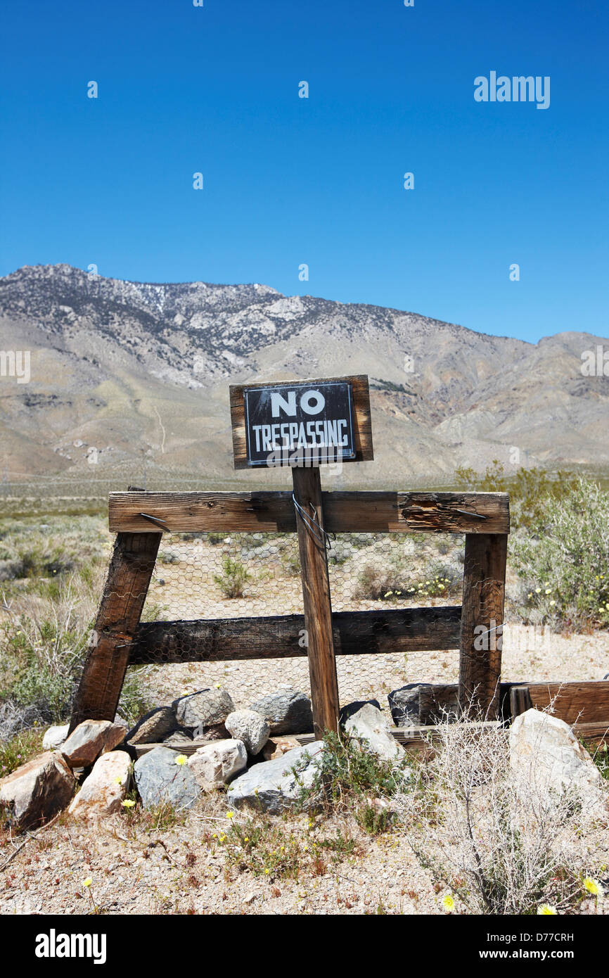 No trespassing sign at foot Sierra Nevada Mountains near Olancha ...