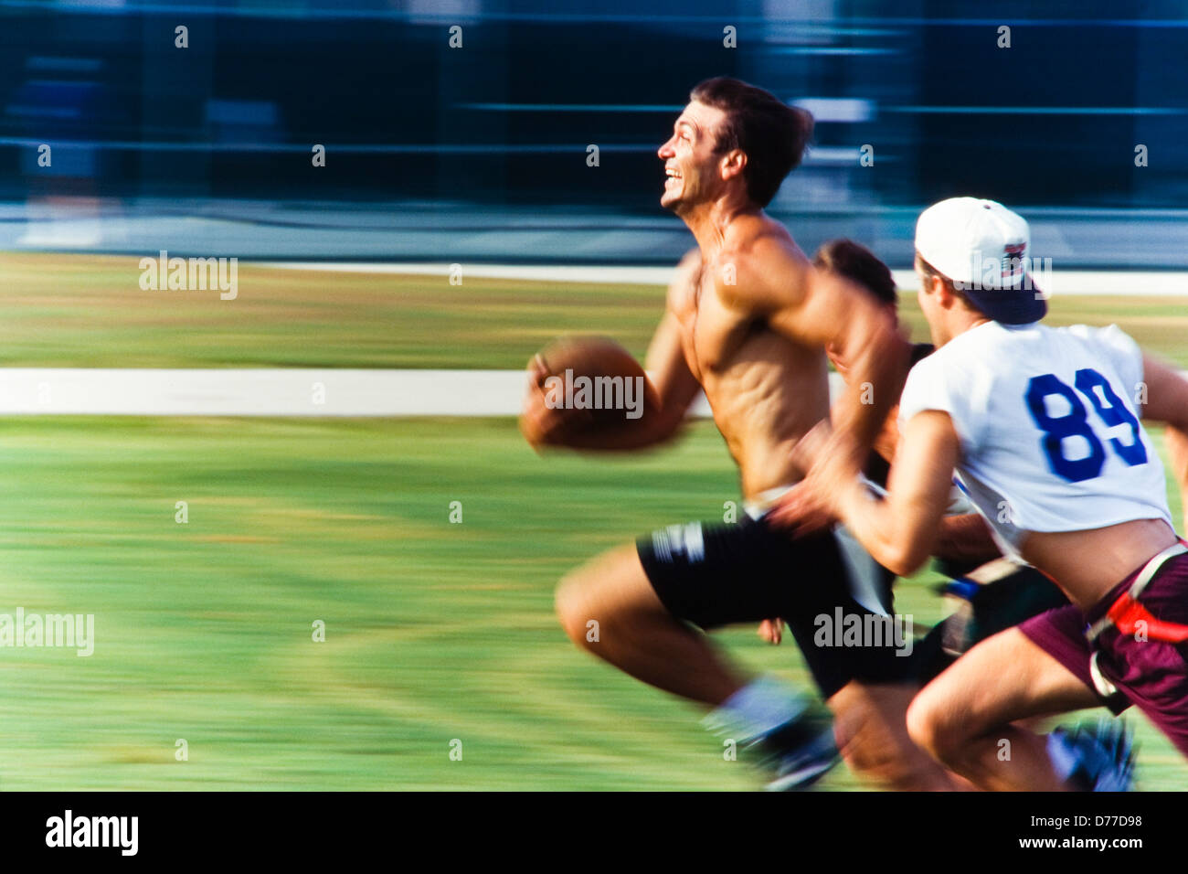 Men playing football, running and motion effects, team competition ...