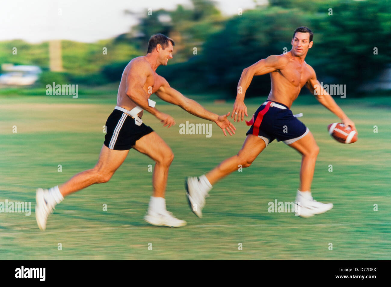 Men playing football, running and motion effects, team competition ...