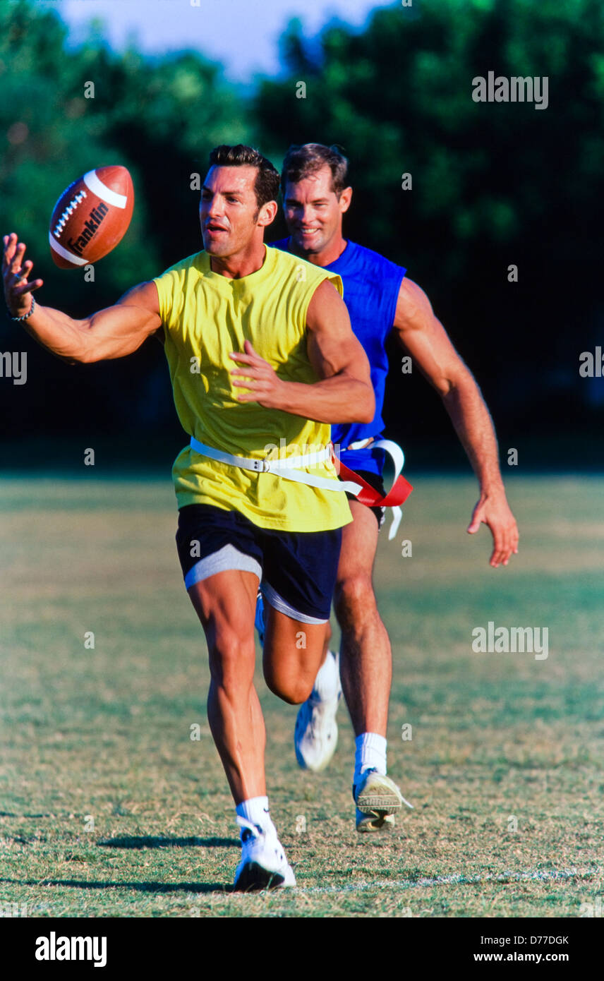 Men playing football, running and motion effects, team competition ...