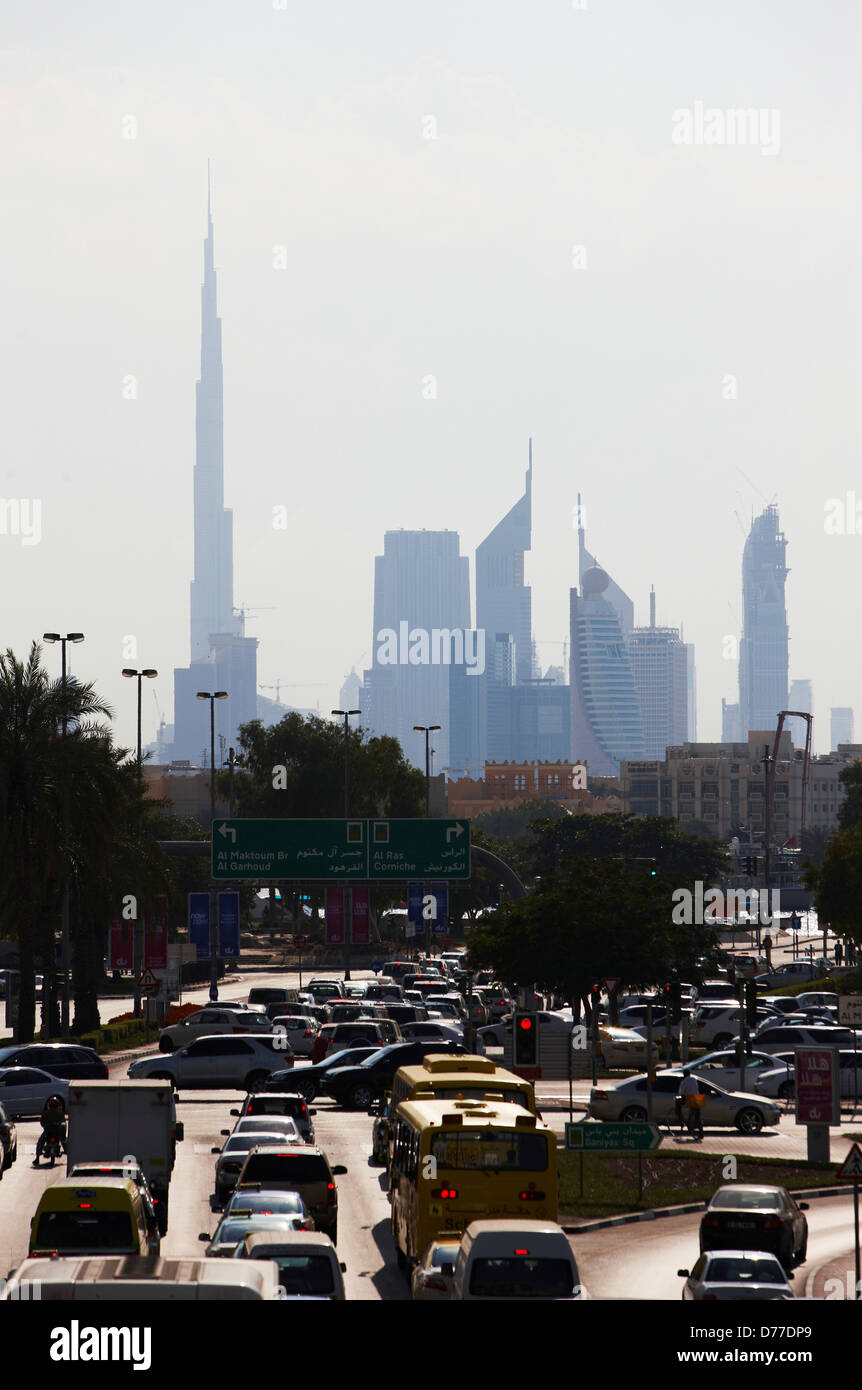 Traffic on road city skyline in background Burj Khalifa Dubai United ...