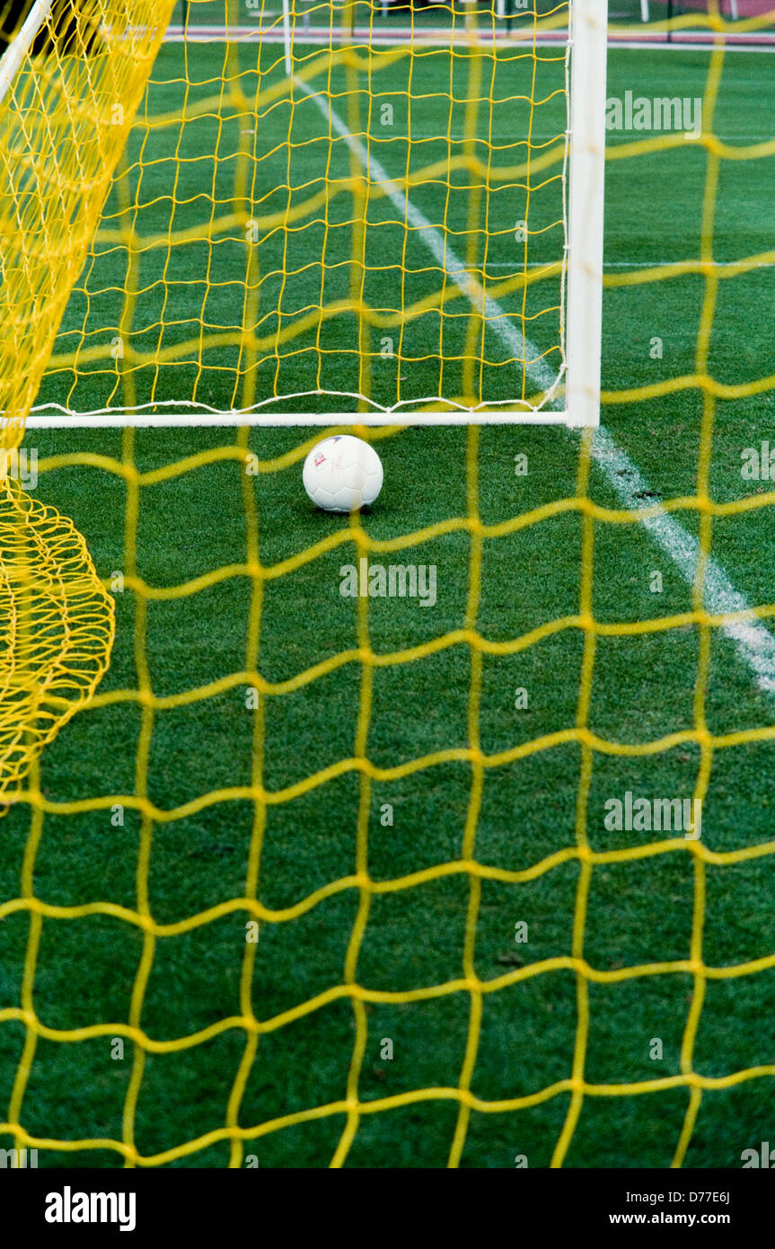 Soccer ball in net, no players visable Stock Photo - Alamy