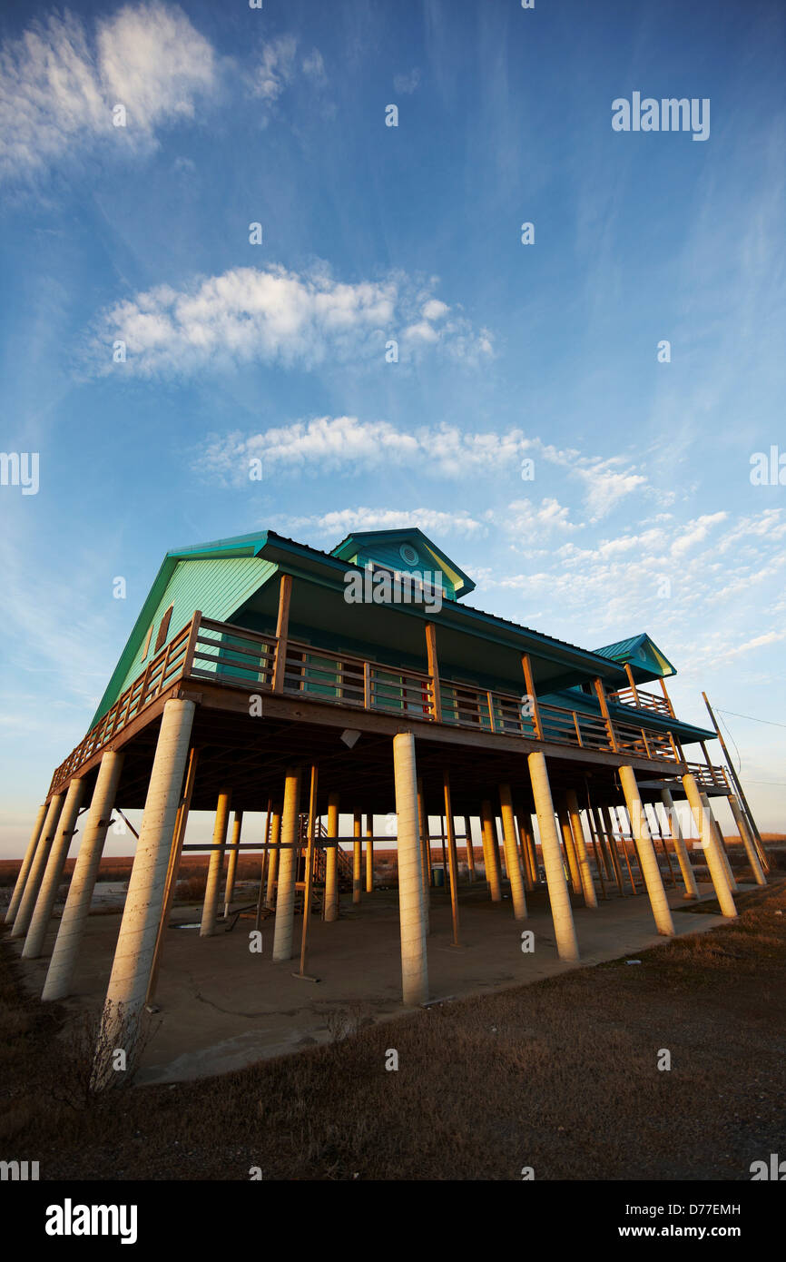 Beach house elevated concrete pilings protection against storm surges ...