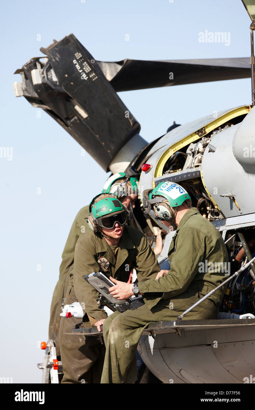 United States Marine Corps aircraft maintenance specialists working on ...