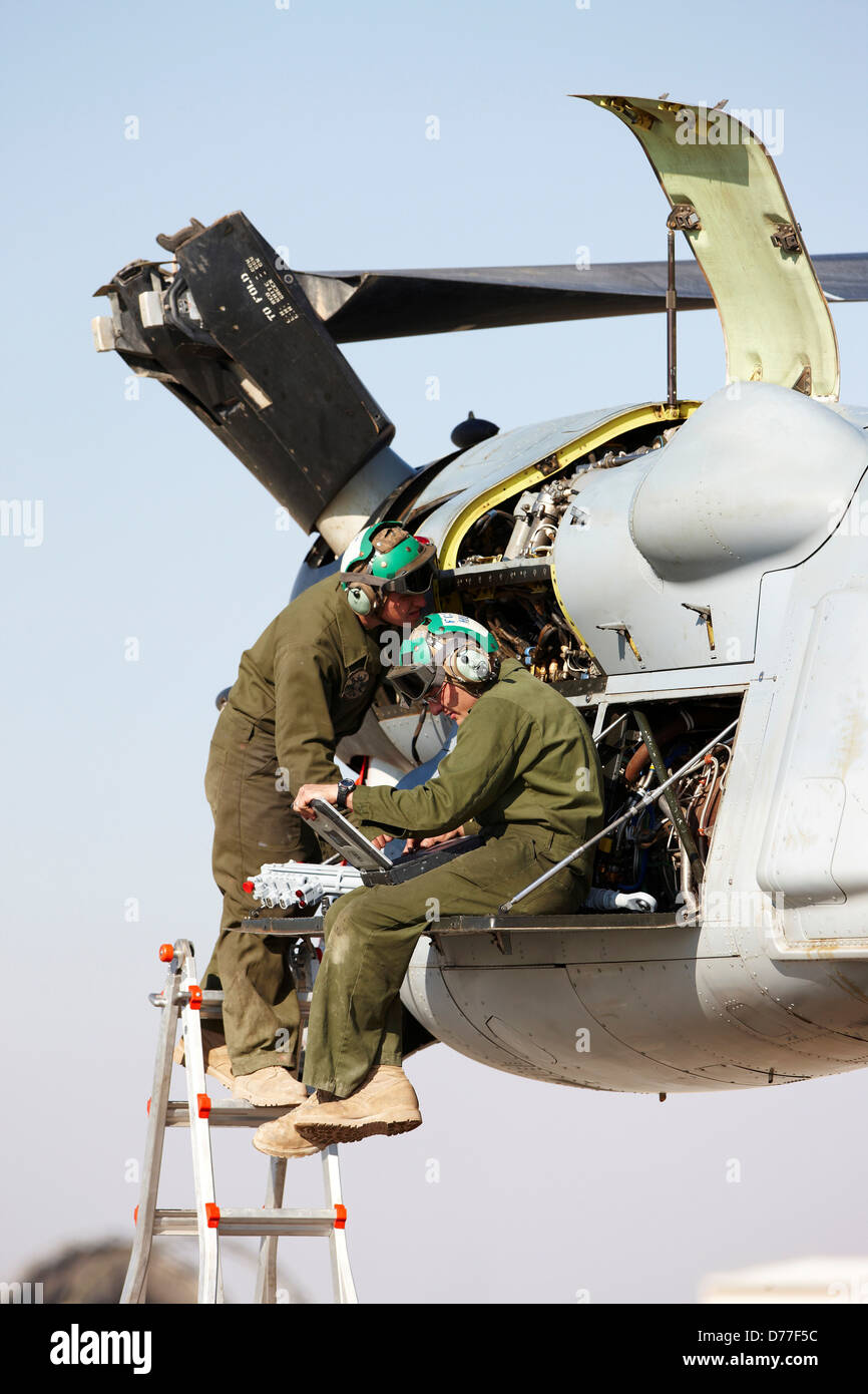 United States Marine Corps aircraft maintenance specialists working on ...