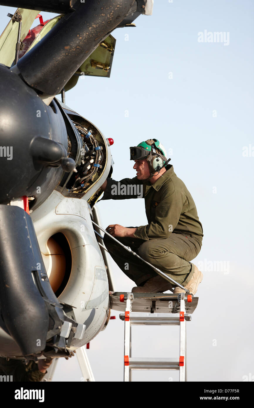 United States Marine Corps aircraft maintenance specialist working on ...