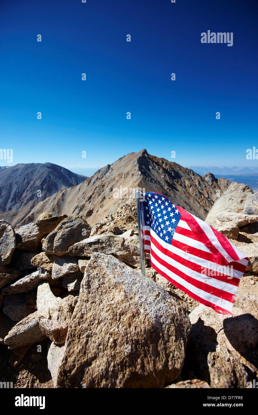 USA Nevada California American flag flaps in wind on summit Boundary ...