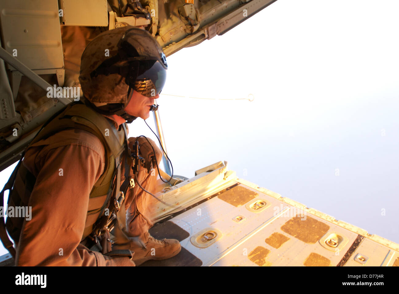US Marine Corps aviation crew chief on cargo ramp KC-130J Super ...