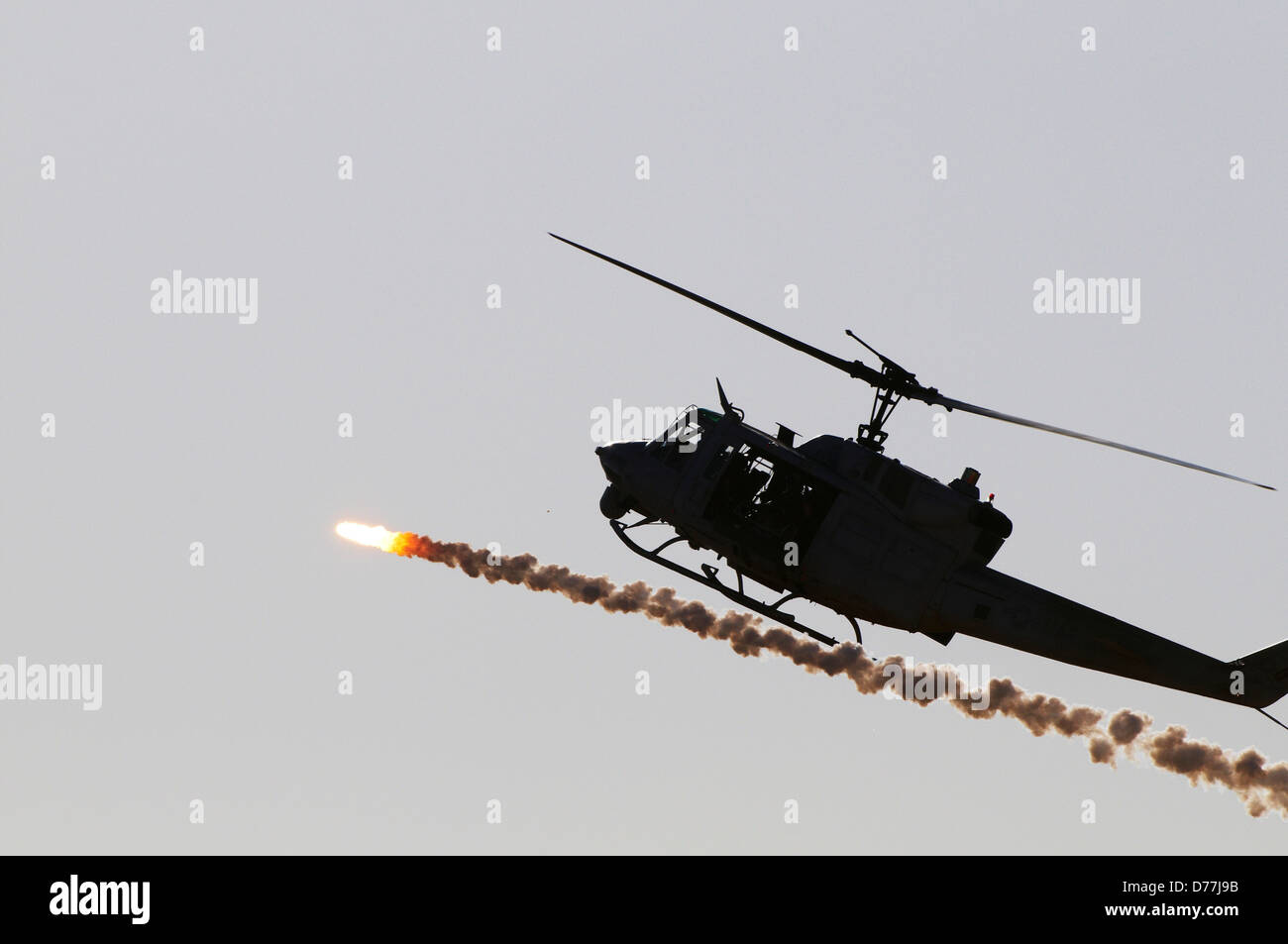 US Marine Corps UH-1N Iroquois Helicopter expends flare during military ...