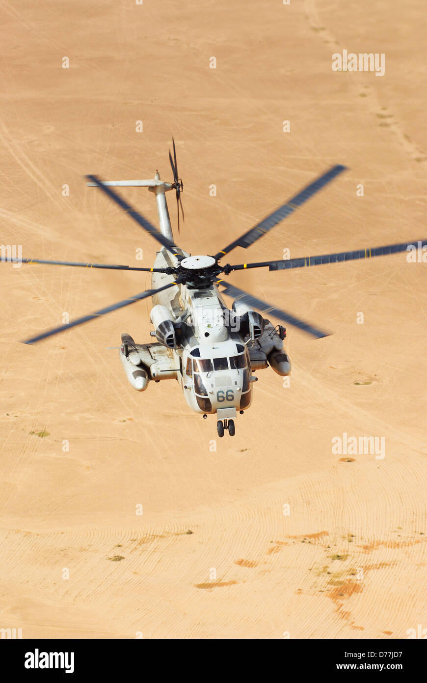 Air to air view US Marine Corps CH-53D Sea Stallion flying over desert ...