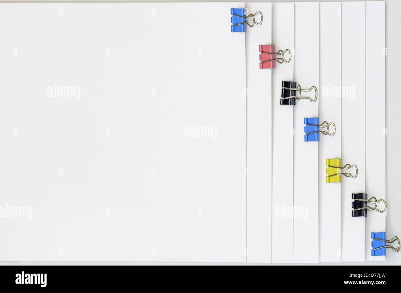 Office Clamps On Paper 01 Stock Photo - Alamy