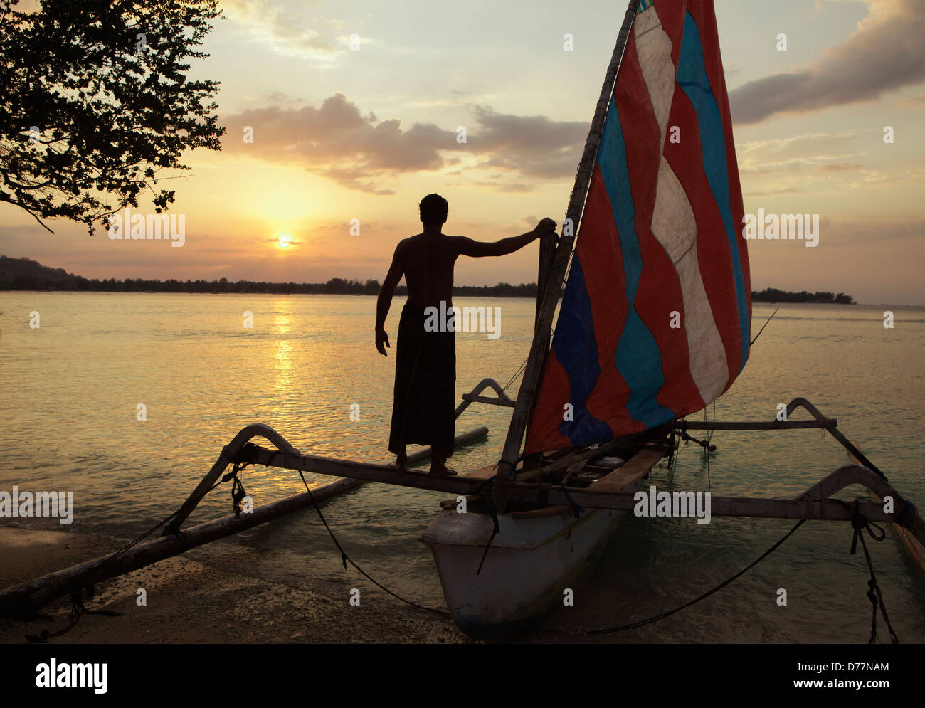 Man standing in fishing boat at sunset hi-res stock photography and ...