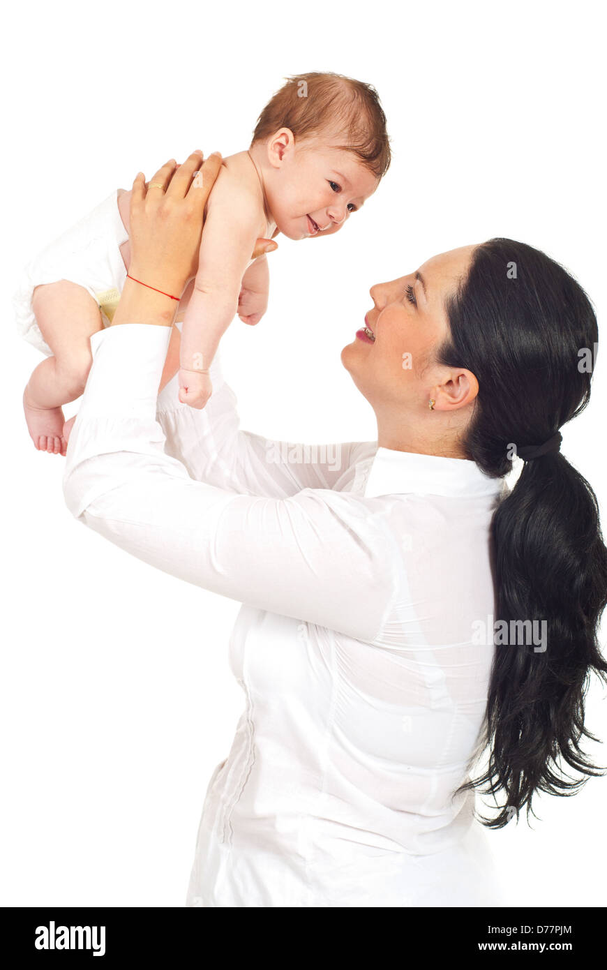 Happy mother raise overhead her newborn baby boy isolated on white ...