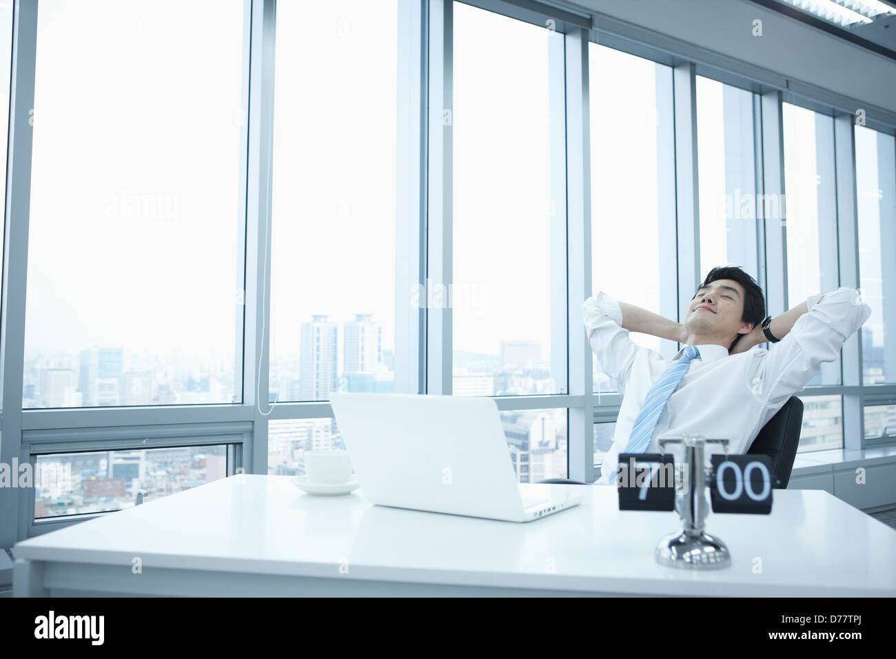 Businessman leaning back of chair hi-res stock photography and images ...