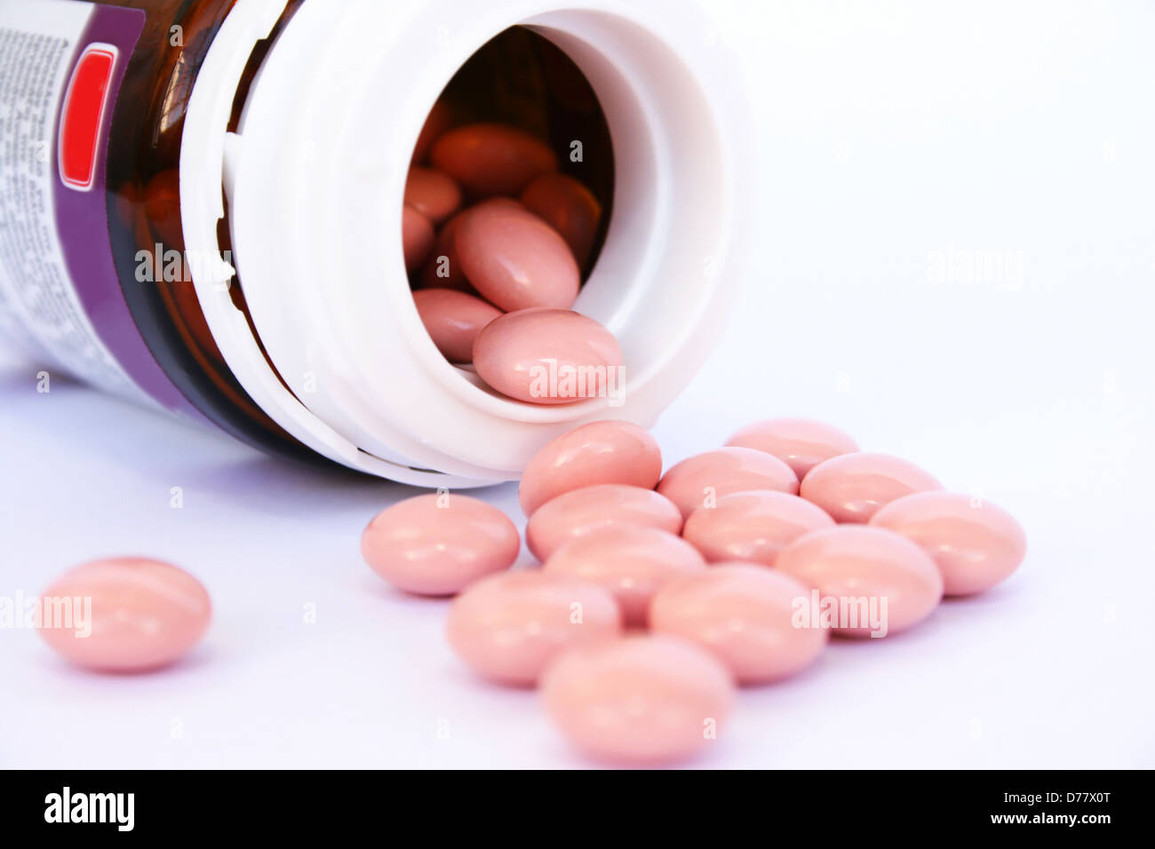 Medical tablets and container on gray background Stock Photo - Alamy