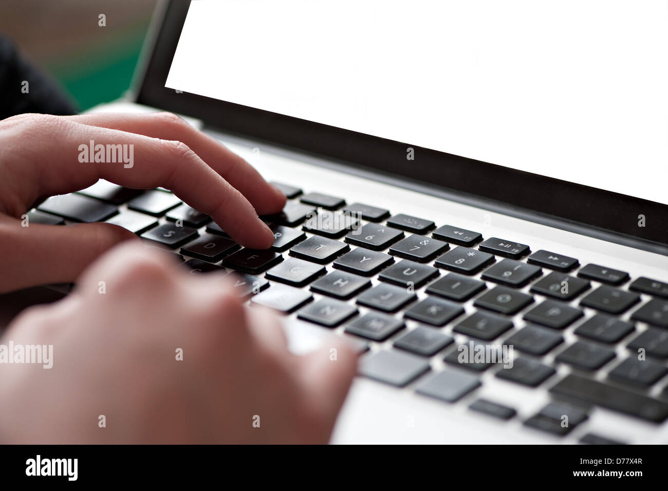 A young person using a laptop with white screen Stock Photo - Alamy