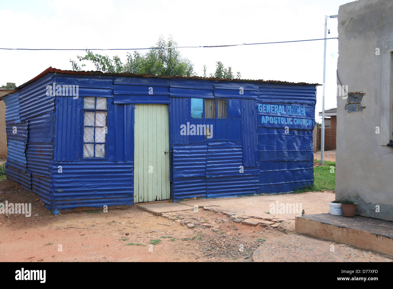 Apostolic church services take place in a blue painted tin shack Stock ...