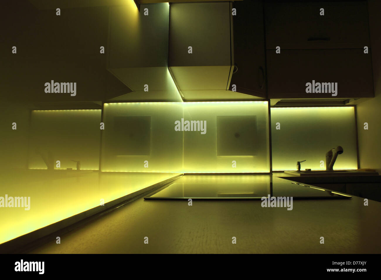 modern luxury kitchen with yellow led lighting Stock Photo - Alamy