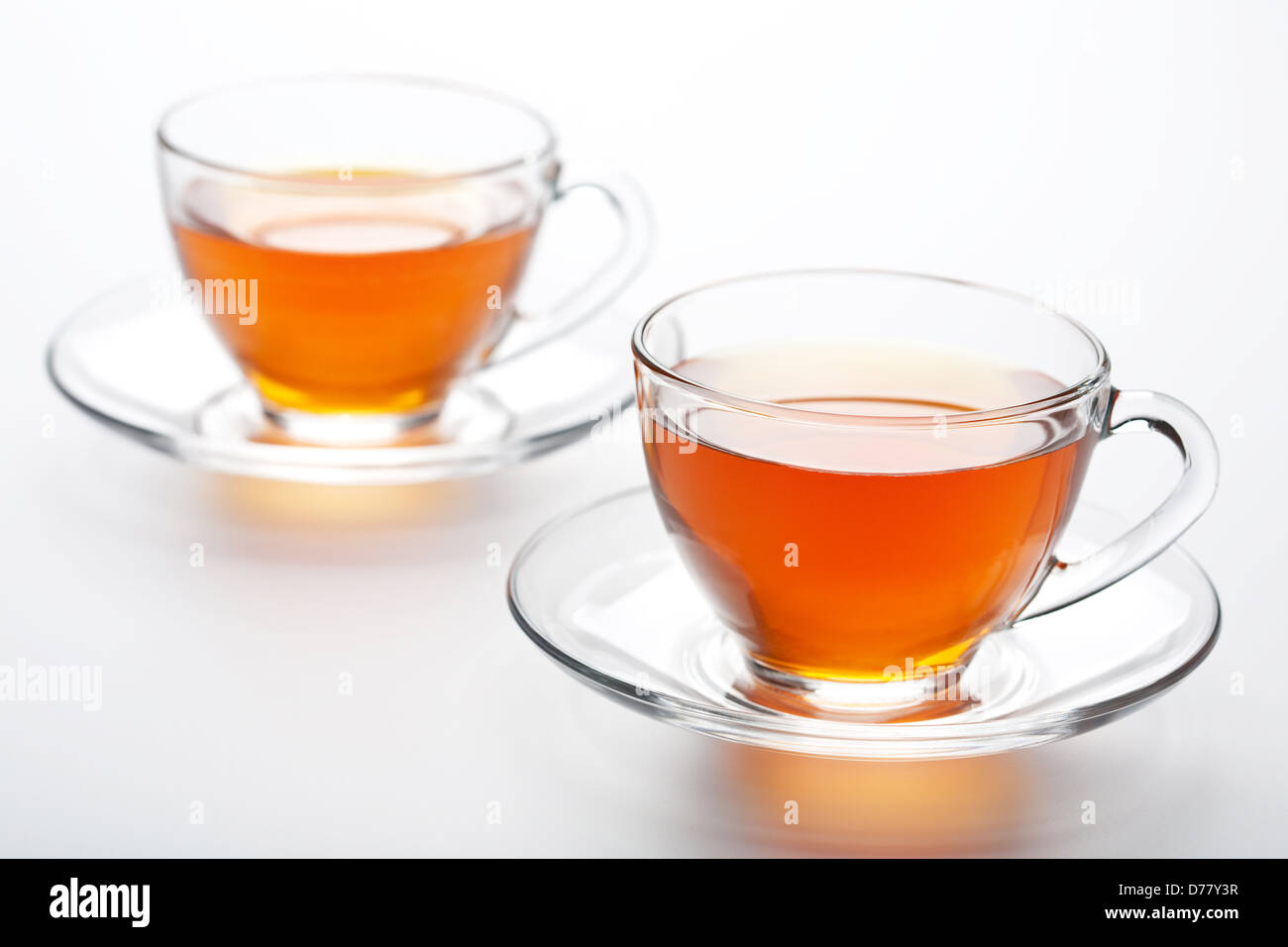 two cups of tea over white background Stock Photo - Alamy
