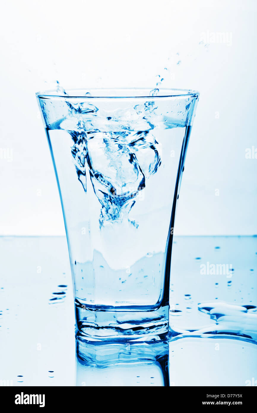pure water splashing into glass Stock Photo - Alamy