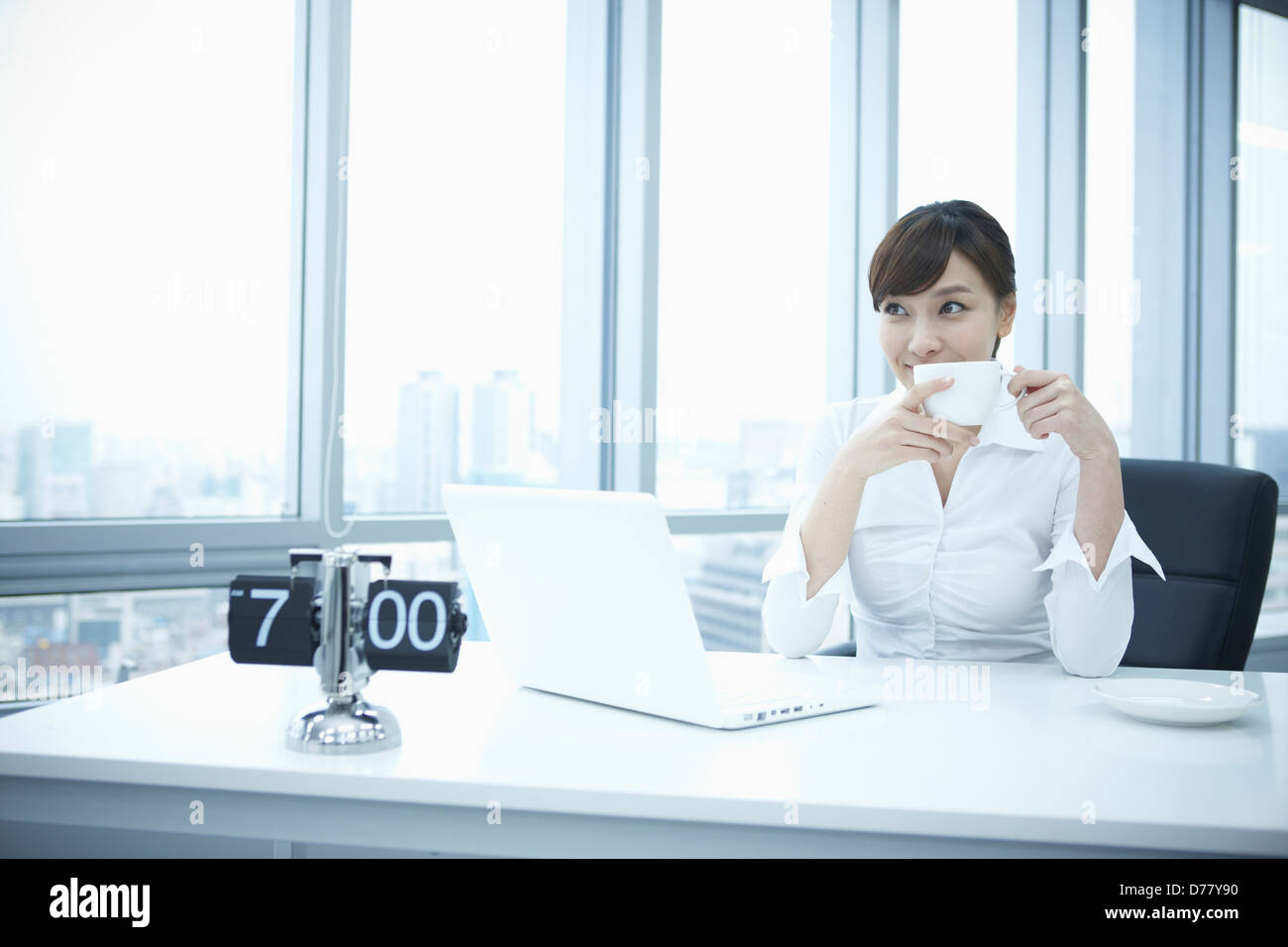 Woman drinking tea computer desk hi-res stock photography and images ...