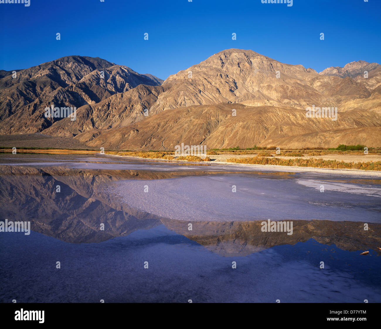 Inyo Mountains reflected in Salt Lake salt pan advancing shore Saline ...