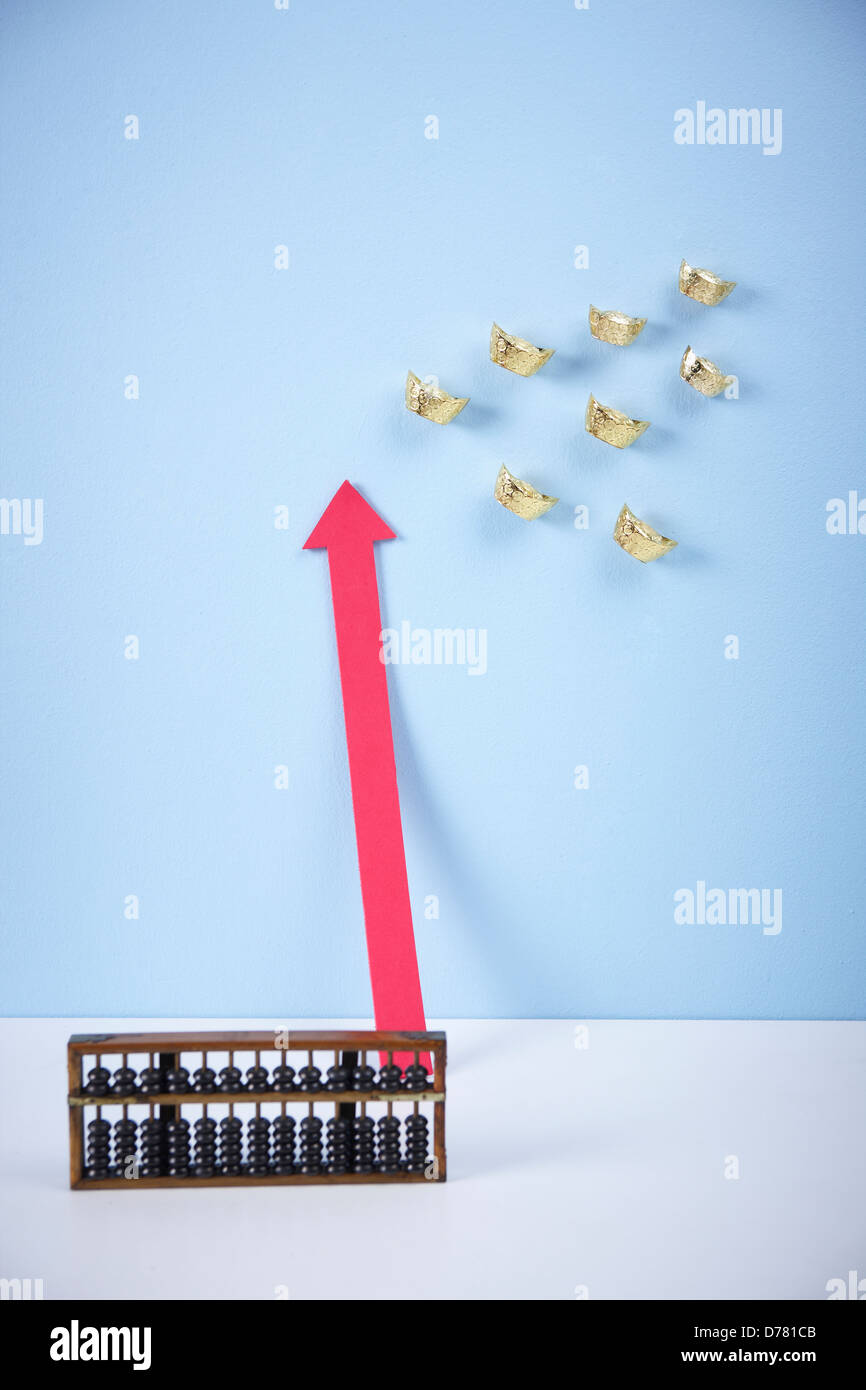 Chinese golden nuggets and a increasing graph Stock Photo - Alamy