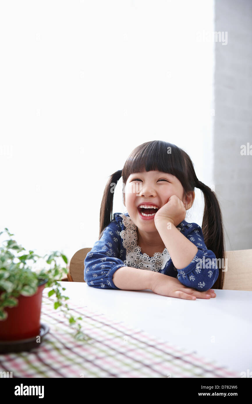 Girl sitting on chair posing hi-res stock photography and images - Alamy