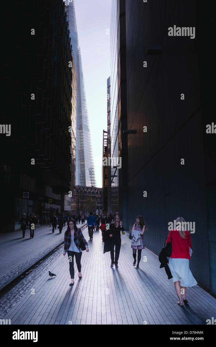 People walking in sunlight london Stock Photo - Alamy