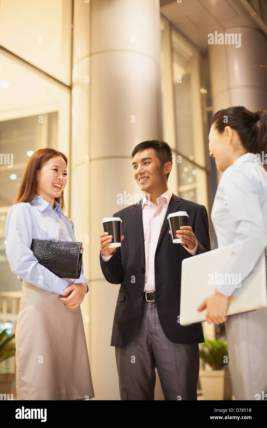 three business people talking outside the office Stock Photo - Alamy