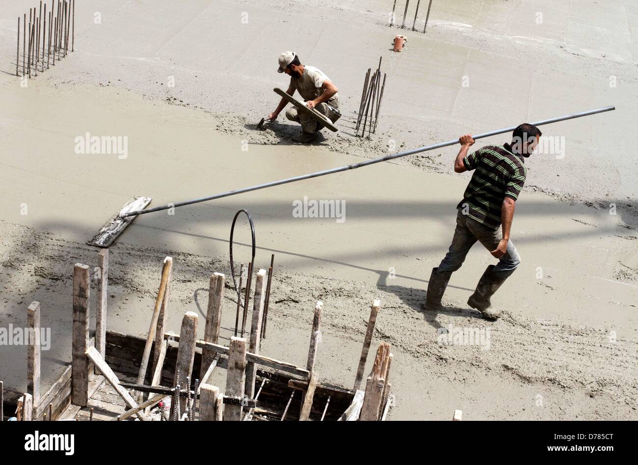 Gaza City, Gaza Strip. May 1, 2013. Palestinian construction workers ...