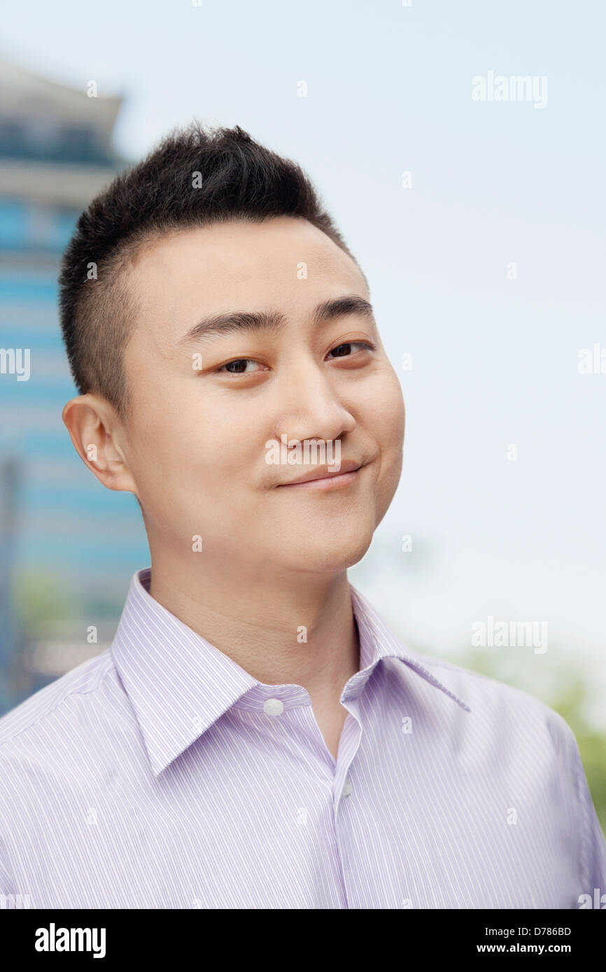 Young man standing outside, portrait Stock Photo - Alamy