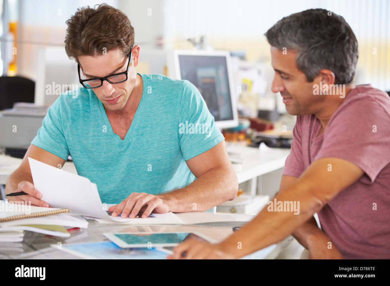 Two Men Meeting In Creative Office Stock Photo - Alamy