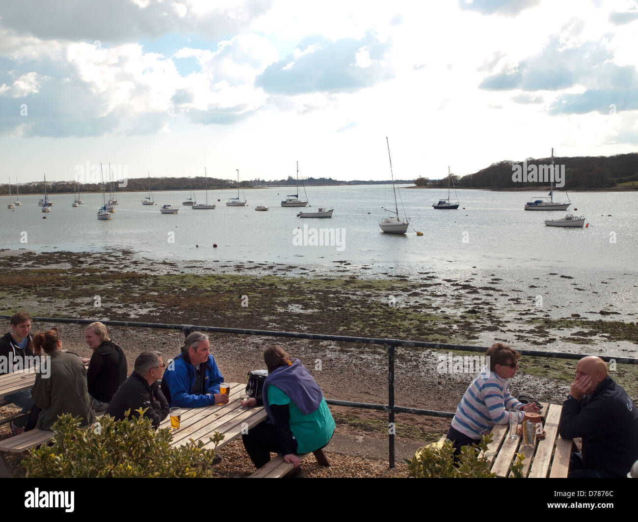 The beer garden of the Crown and Anchor pub in Dell Quay,looking out on ...