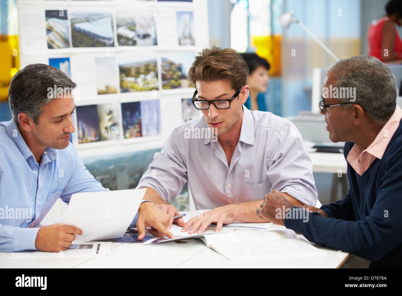 Group Of Men Meeting In Creative Office Stock Photo - Alamy