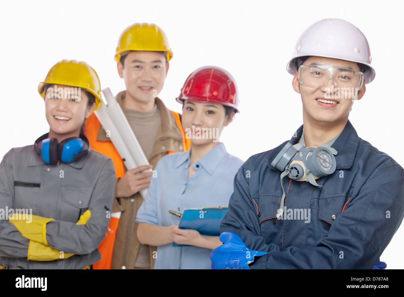 Four construction workers against white background, focus in foreground ...