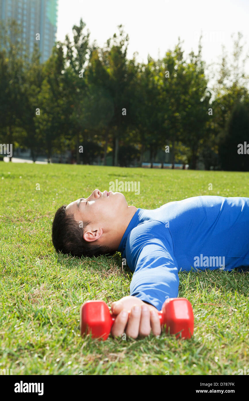 Young athletic man lying down hi-res stock photography and images - Alamy