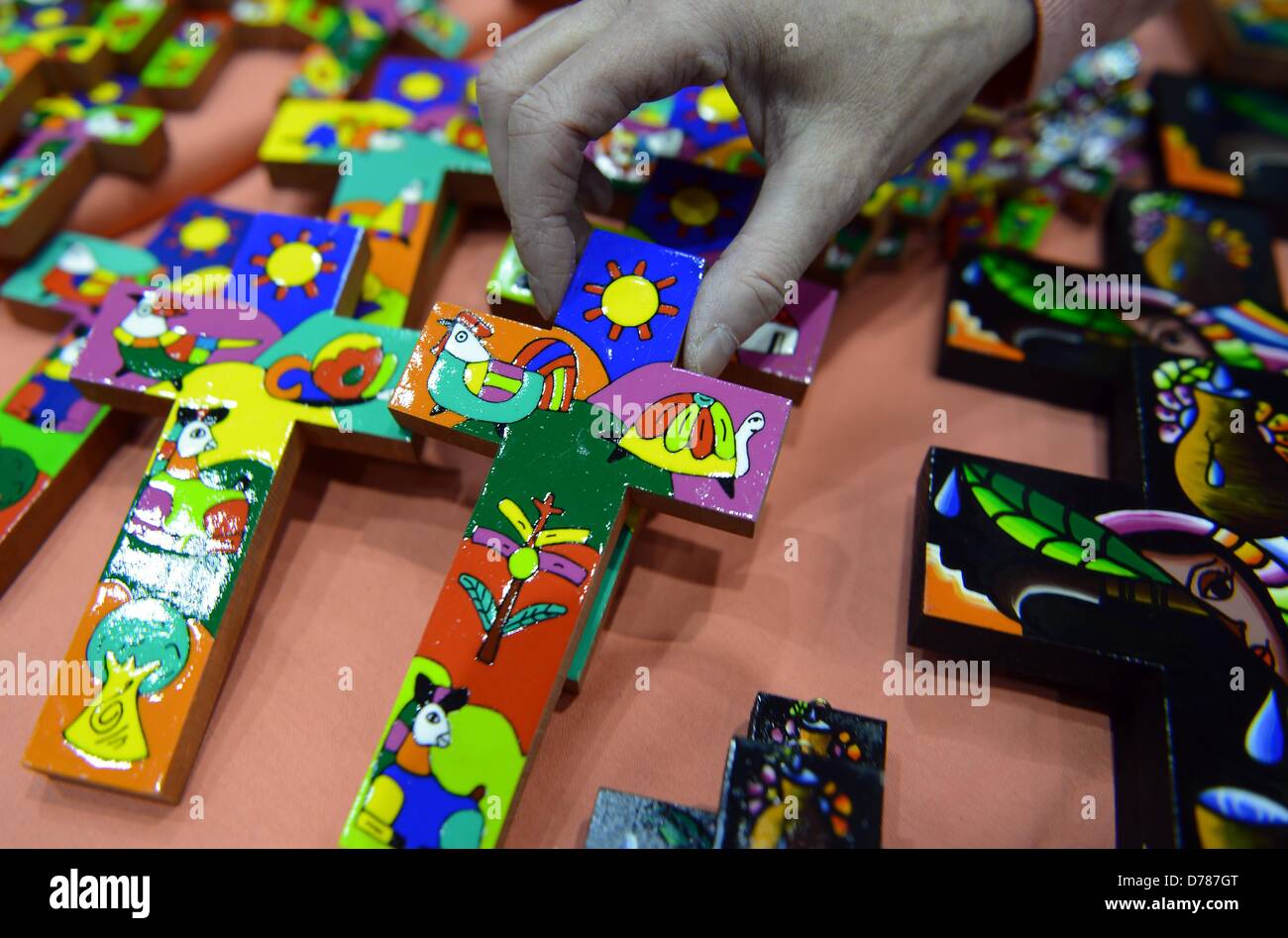 Painted wooden crosses are on display at the stall of the 34th German ...