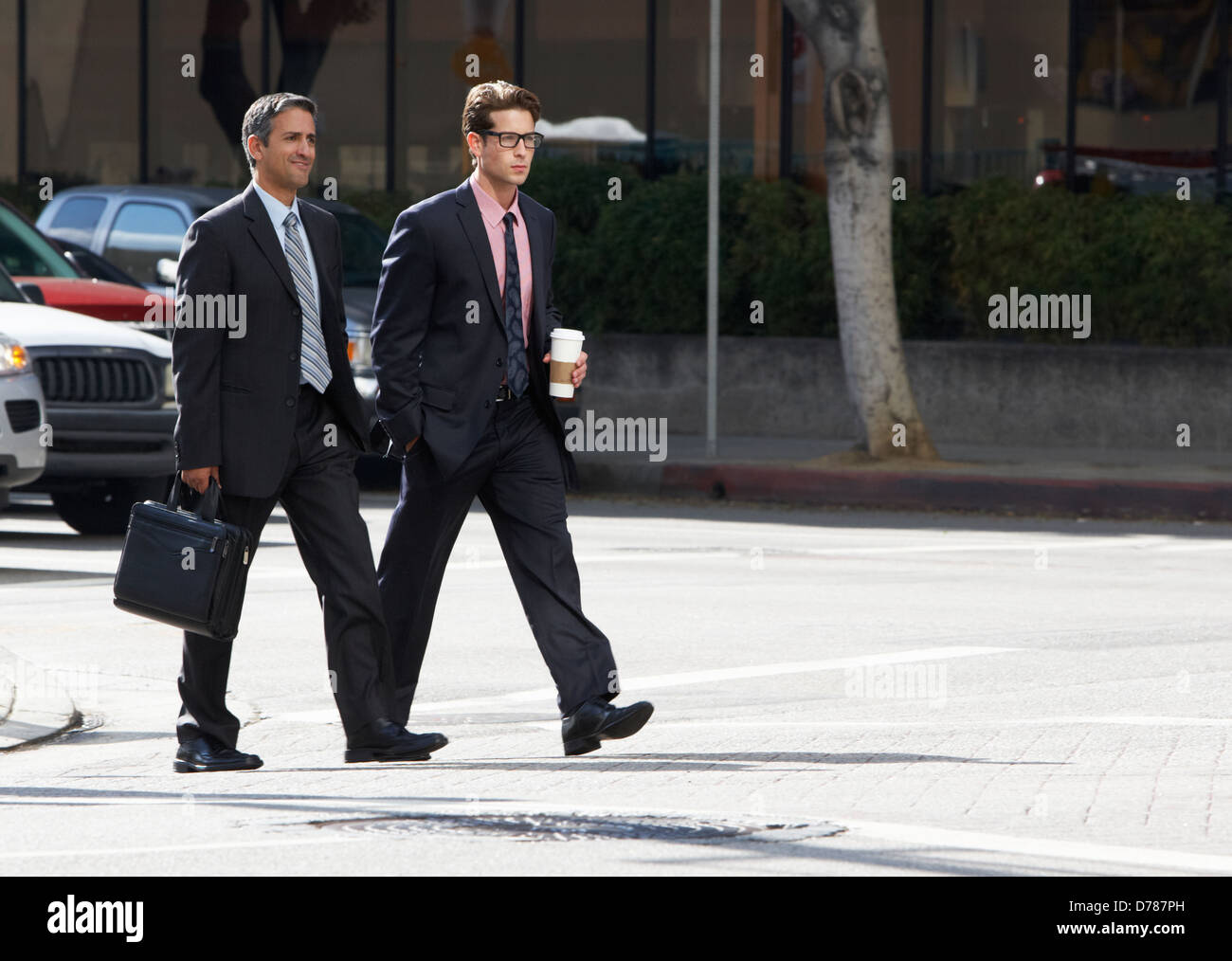 Two men crossing the road hi-res stock photography and images - Alamy