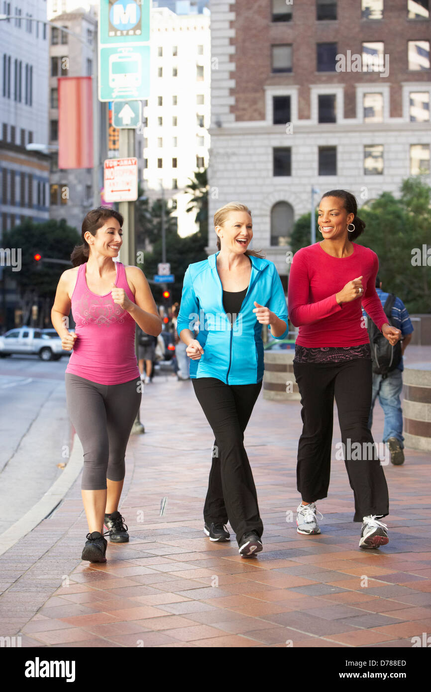Woman power walking on urban street hi-res stock photography and images ...