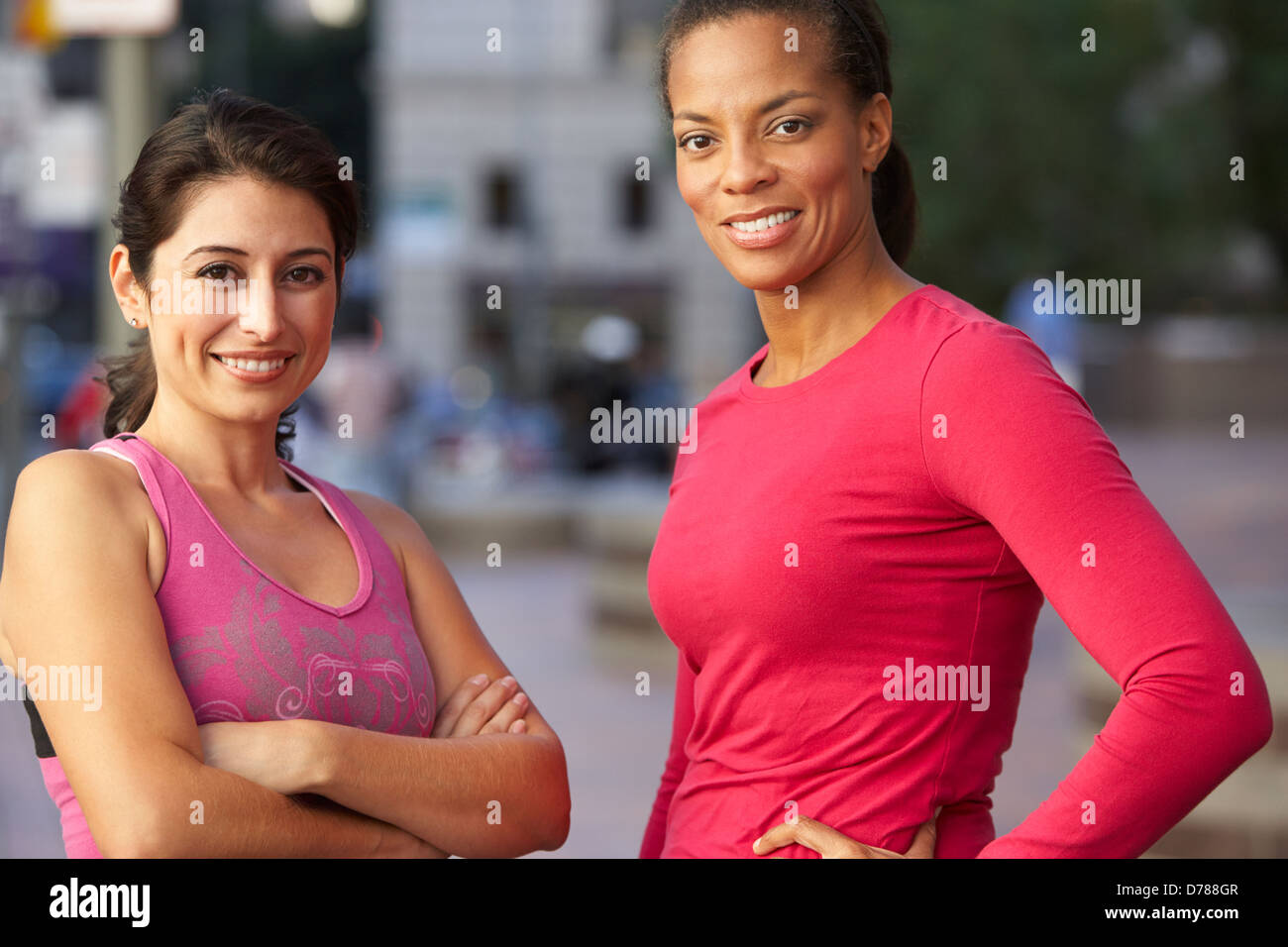 Portrait Of Two Female Runners On Urban Street Stock Photo - Alamy