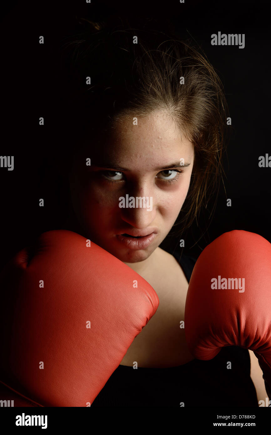 Young girl boxer posing with gloves Stock Photo - Alamy
