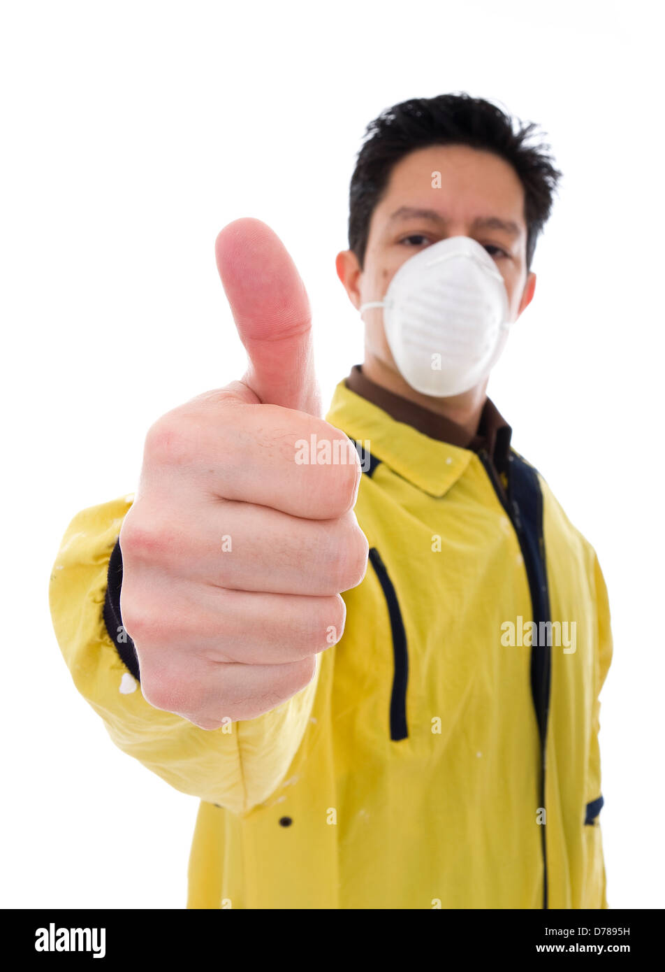 Worker with face mask giving the thumb-up sign Stock Photo - Alamy