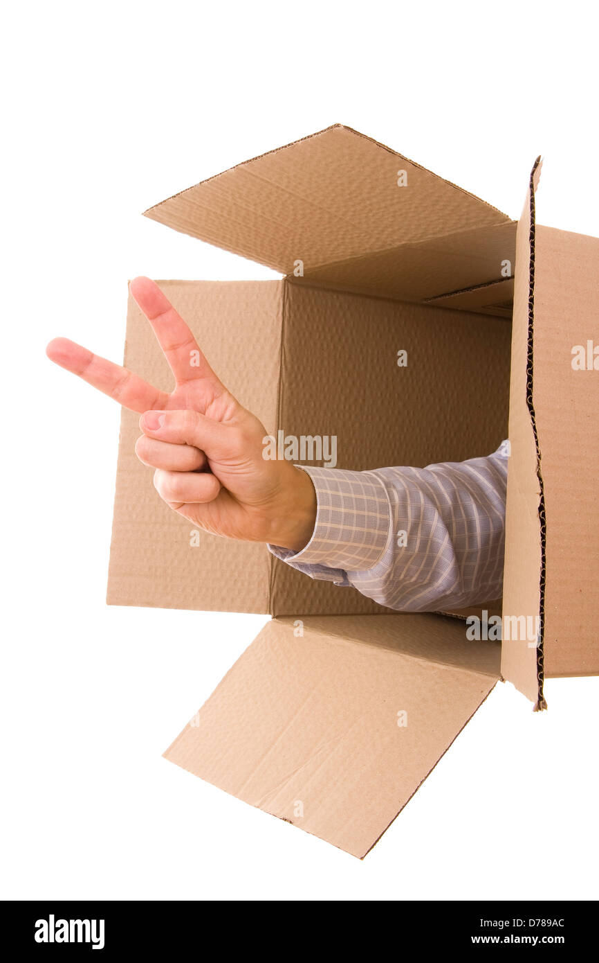 Hand doing victory gesture inside a cardboard box Stock Photo - Alamy