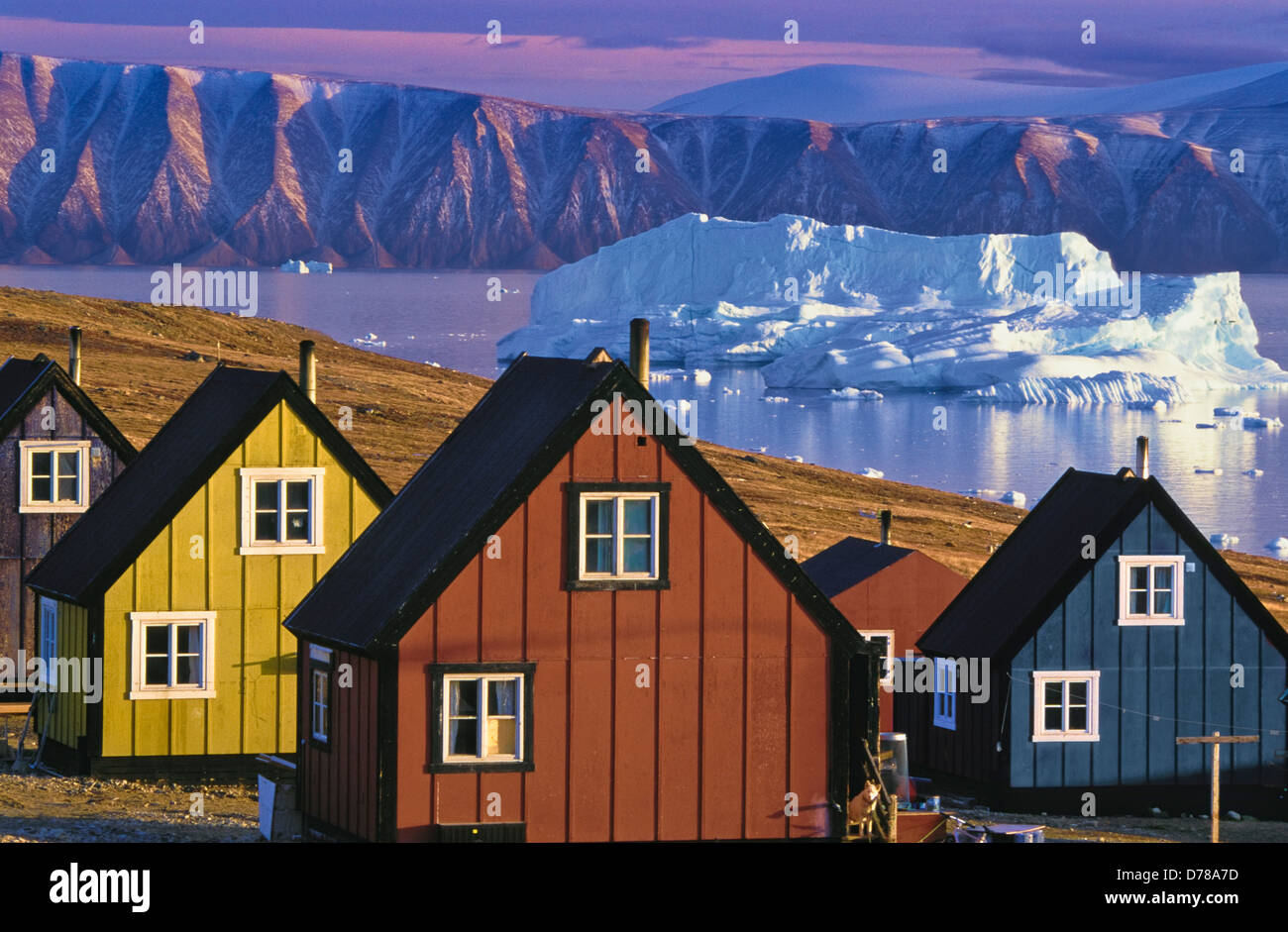 icebergs and colorful houses, Qaanaaq, Northwest Greenland Stock Photo ...