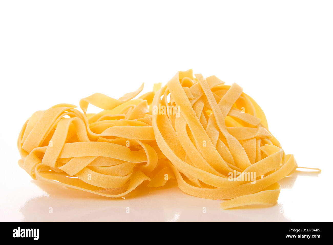 Italian pasta Tagliatelle isolated on white Stock Photo - Alamy