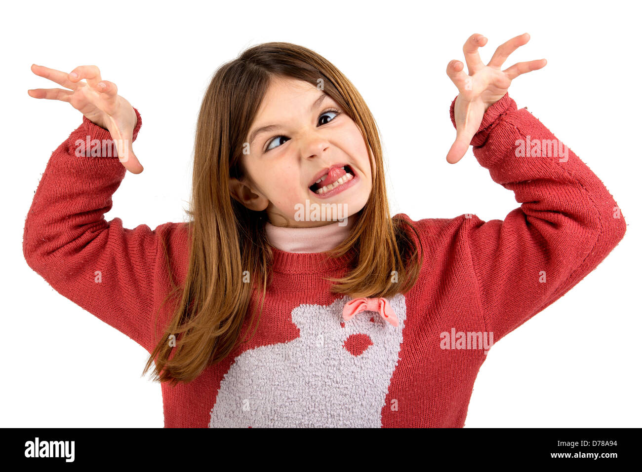 Funny young girl making faces isolated in white Stock Photo - Alamy