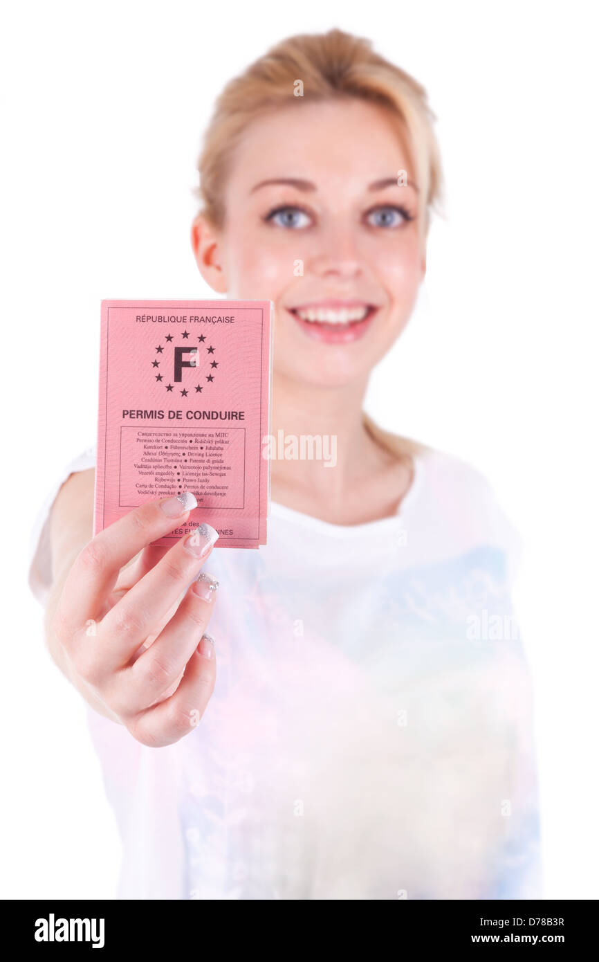 Happy caucasian teenage girl showing her driving license, isolated on ...