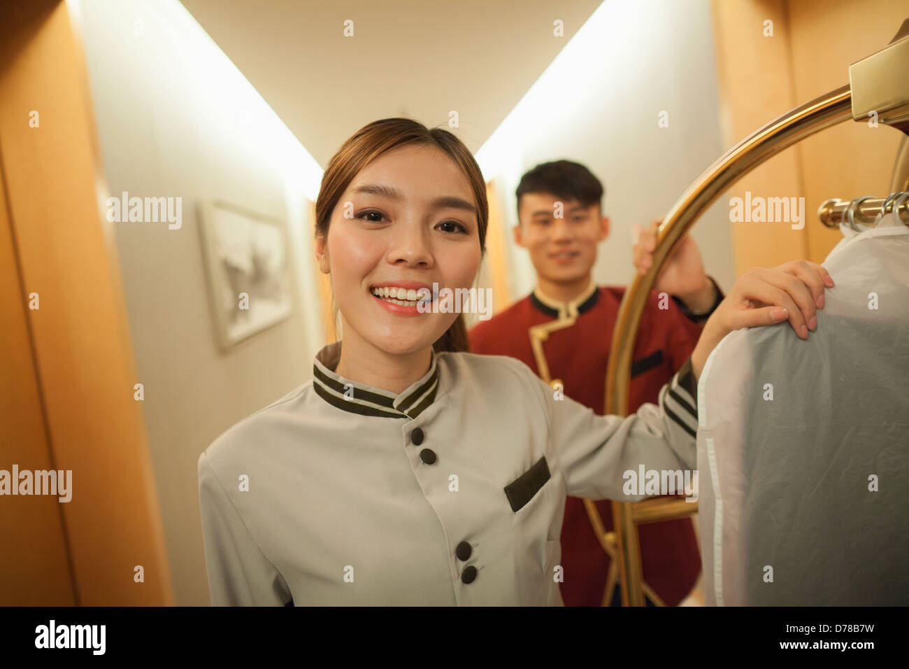 Bellhops in the doorway smiling hi-res stock photography and images - Alamy